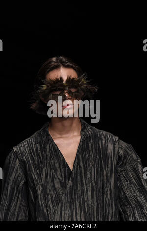 Jakarta, Indonesia. 25th Oct, 2019. Models present creations of Iwa ...