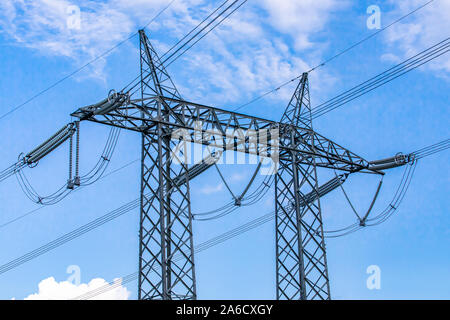 Electric pylon in perspective seen below with light blue background ...