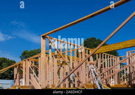 Exterior view construction new residential home framing Stock Photo - Alamy