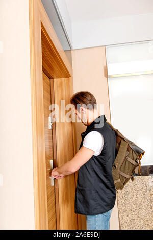 Man locking his door Stock Photo - Alamy