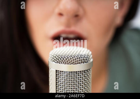 Young Woman Recording ASMR Sounds On Microphone Stock Photo - Alamy
