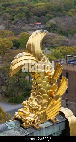 Gold carp scales statue Stock Photo - Alamy