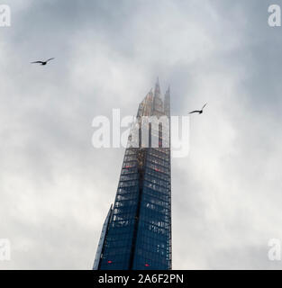 Misty sunset surrounding the top of the Shard, London England UK Stock ...