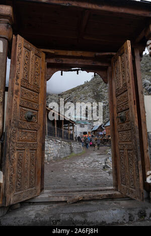 The richly carved back entrance door of the Mathi temple. Chitkul ...
