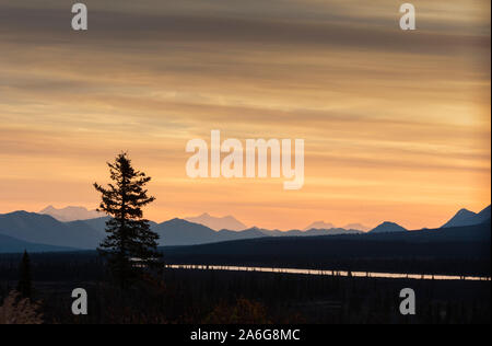 Alaska Range Mt Hayes Mt Hess reflection in lake along Denali highway ...