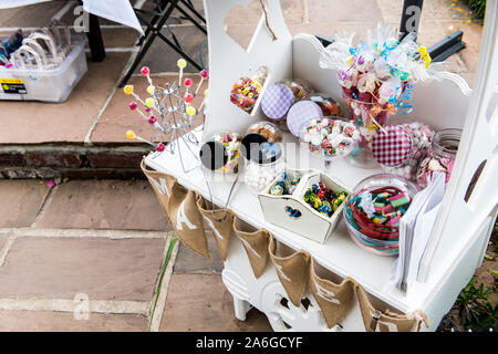 A beautiful wedding sweet cart with an variety of sweets ready for ...