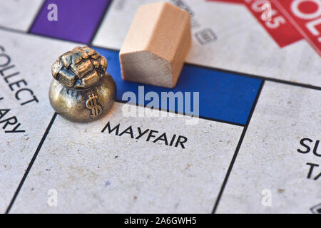 "MAYFAIR" on a Monopoly board with the car and two hotels Stock Photo ...