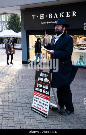 Evangelist Christian street preacher, with Holy Bible, preaching to ...