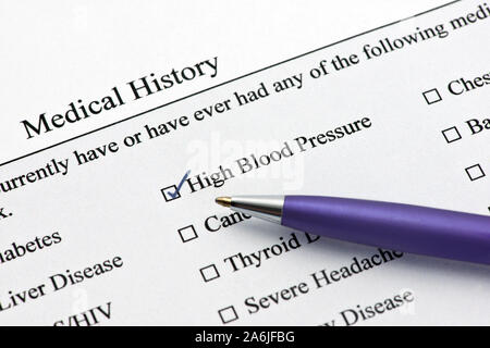 Patient medical history form with pen isolated on white background ...