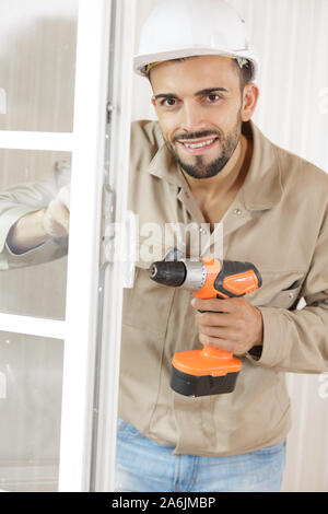 drilling a window frame Stock Photo - Alamy