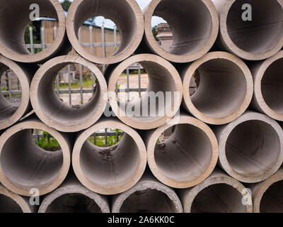 Precast Concrete Drainage pipes stacked up on construction site for new ...