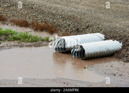 Gravel Road Drainage Culvert Pipe In The Rain Water Flooding Stock ...