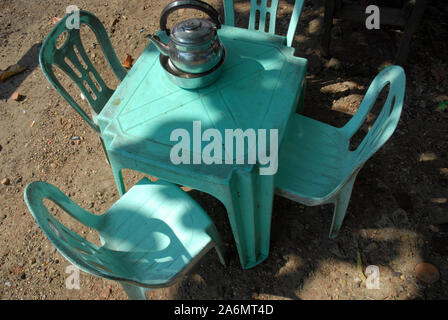 Teapot and set of green plastic chairs, Yangon, Myanmar, Asia Stock ...