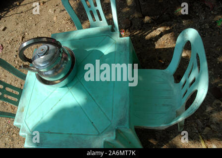 Teapot and set of green plastic chairs, Yangon, Myanmar, Asia Stock ...