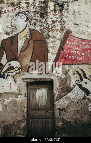 ORGOSOLO, SARDINIA /OCTOBER 2019: The old tradition of cooking the ...