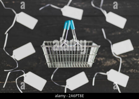 sales strategy and customer purchases, shopping basket surrounded by ...