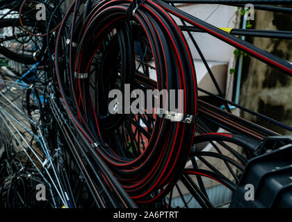 Tangled messy electrical wires on pole posing a safety hazard Stock ...