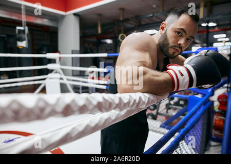 Fighter man with lean muscular body outdoors holding nunchaku Stock ...