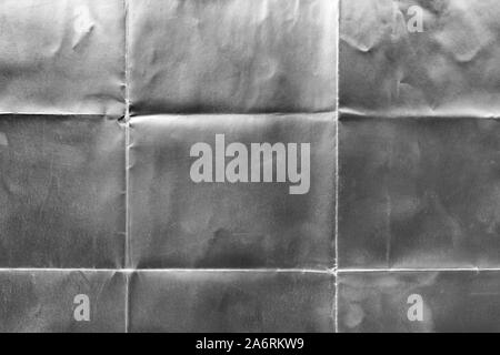 Silver wrapping paper with scratches and folds, texture background ...