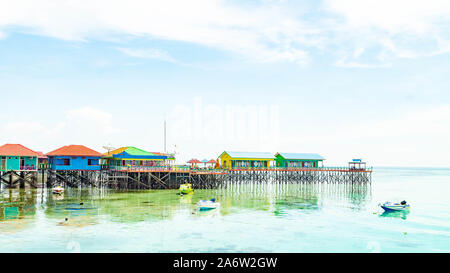 beautiful and colorful cottages at Derawan Island Resort, Borneo ...