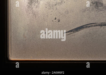 Part of a window covered with condensed water in the sunlight of an ...