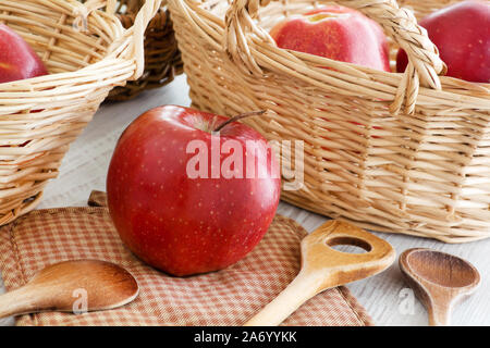 Closeup of vintage basket with organic apples in woman's hands. Garden ...