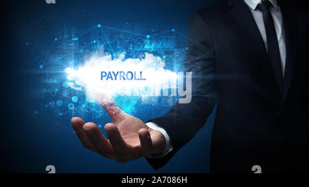 Hand of Businessman holding PAYROLL inscription, successful business ...