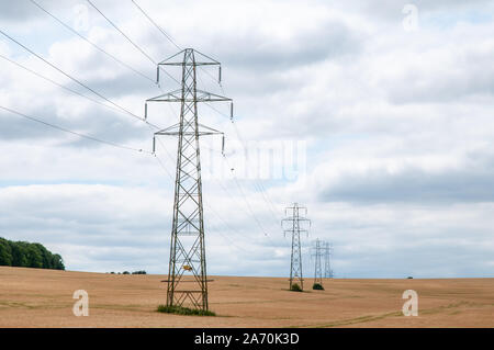 Electricity pylons crossing the countryside in Carmarthenshire, west ...