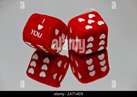 Two red dice with hearts as numbers Stock Photo - Alamy