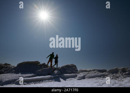 Woman Exploring frozen winter landscape in the mountains Stock Photo ...