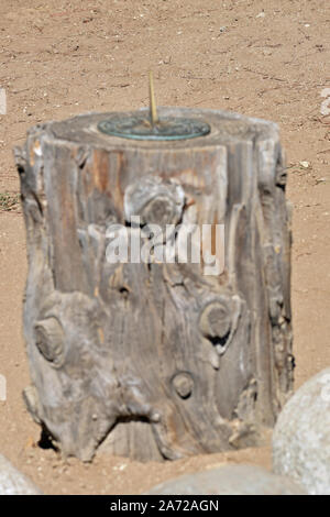 Sundial on a Tree Stump Stock Photo - Alamy