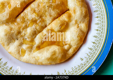 Numtrak balep, Tibetan deep fried bread on two plates. Popular ...