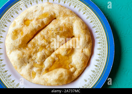 Numtrak balep, Tibetan deep fried bread on two plates. Popular ...