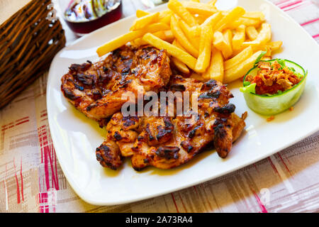Traditional Balkan dish Pileci Batak - fillets of chicken thighs grill ...
