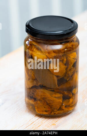 Tasty canned milk mushrooms marinated at glass jar Stock Photo - Alamy