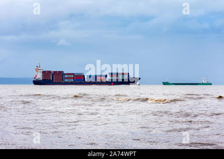 A container ship loaded with containers departs from the Qianwan ...