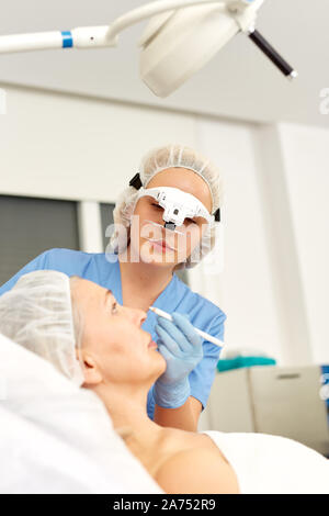 Mature woman getting ready for plastic surgery closeup Stock Photo - Alamy