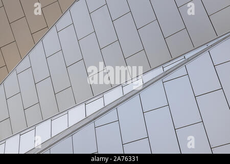 Close-up of geometrically designed building with white tiled walls ...