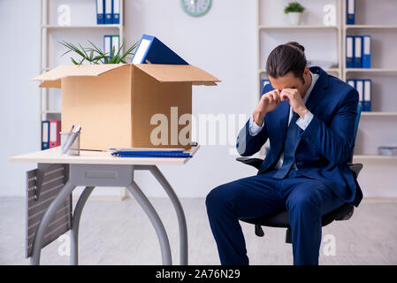 The young employee being made redundant Stock Photo - Alamy