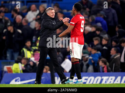Anthony Martial of Manchester United hugs Marcos Rojo of Manchester ...