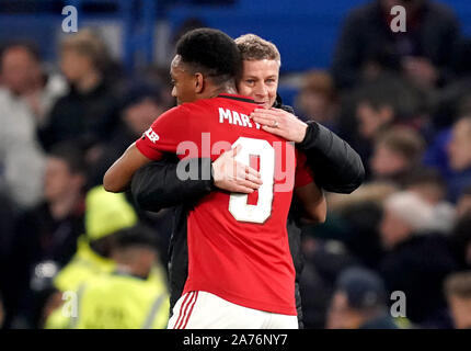 Anthony Martial of Manchester United hugs Marcos Rojo of Manchester ...