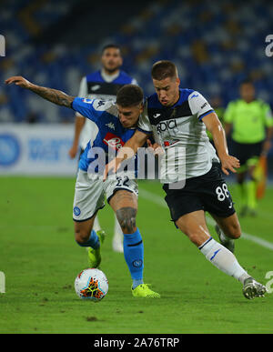 Napoli's Italian defender Giovanni Di Lorenzo challenges for the ball ...