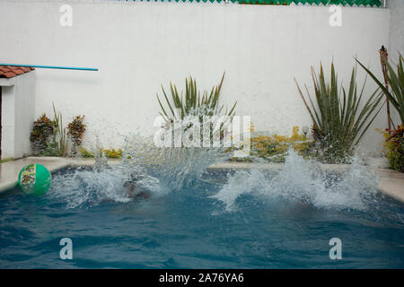 Human pump to the water forming a splash after the dip swimming Stock ...
