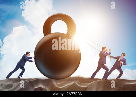 The businessmen trying to deal with difficult task Stock Photo - Alamy