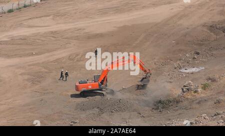 Enginers of 4M defense use an armored excavator with tillers and ...