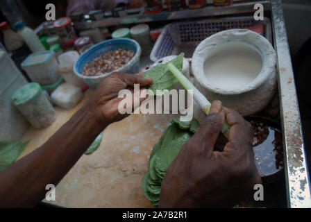 Man preparing betel chew in Myanmar. Betel quid or Paan is a ...