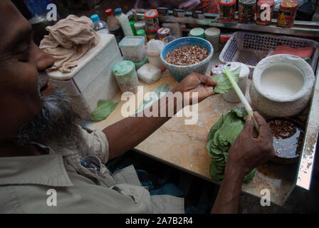 Man preparing betel chew in Myanmar. Betel quid or Paan is a ...