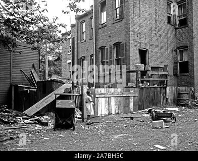Slums in the ghetto of a large American city (possibly Washington D.C ...