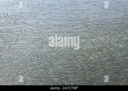 Beautiful and dangerous surface of snow sludge on water Stock Photo - Alamy