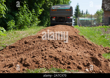 Soil road reconstruction with heavy machinery Stock Photo - Alamy